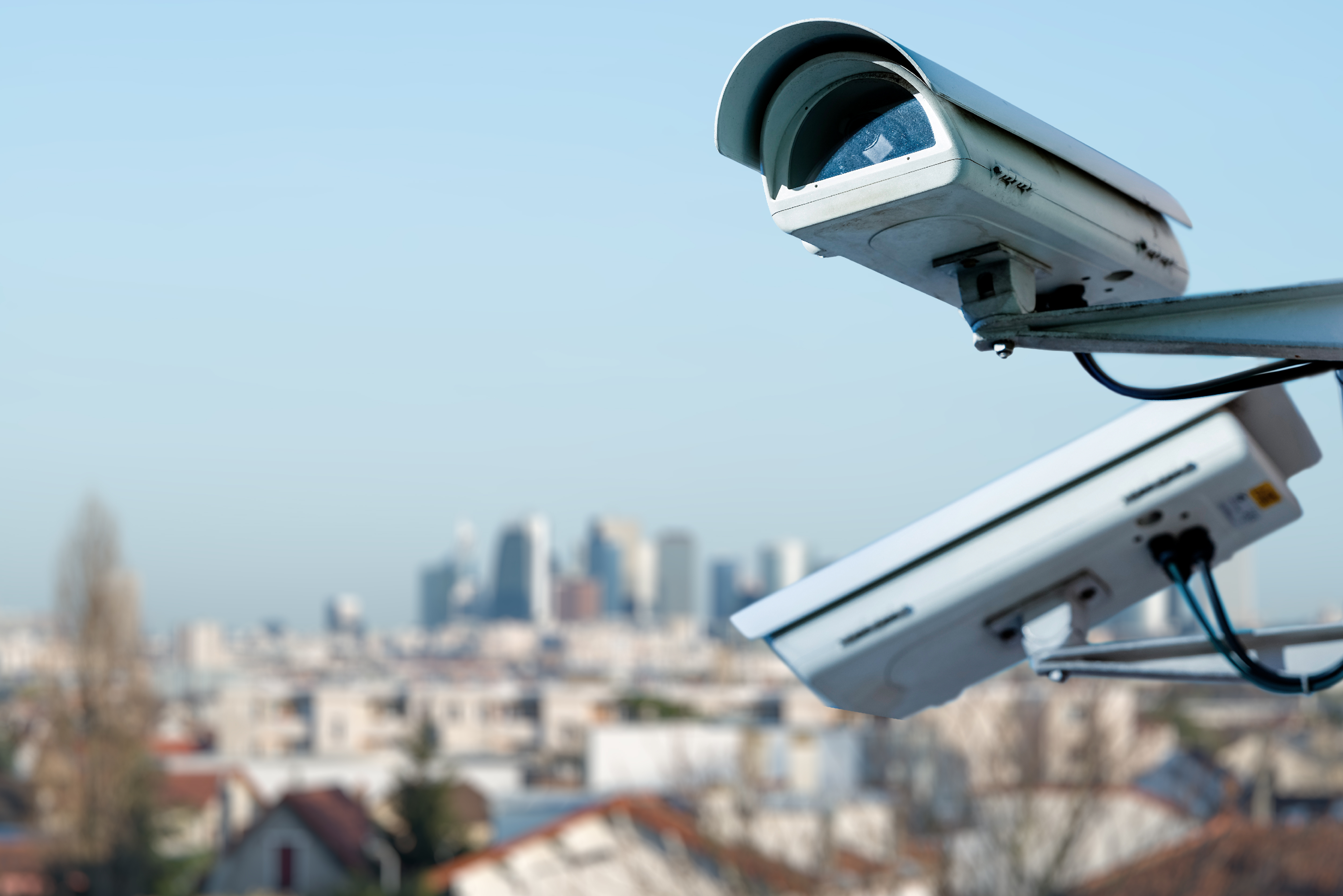 security CCTV camera monitoring system with panoramic view of a city on ...
